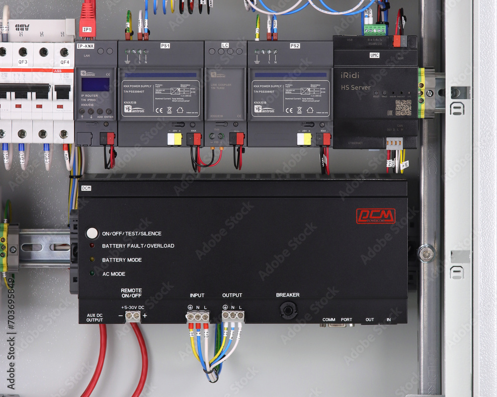 Electronic control modules for apartment automation are installed in an ...
