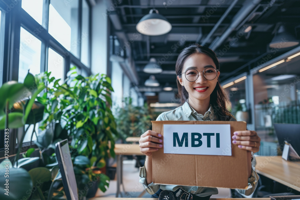MBTI concept image with business woman holding a sign with written ...