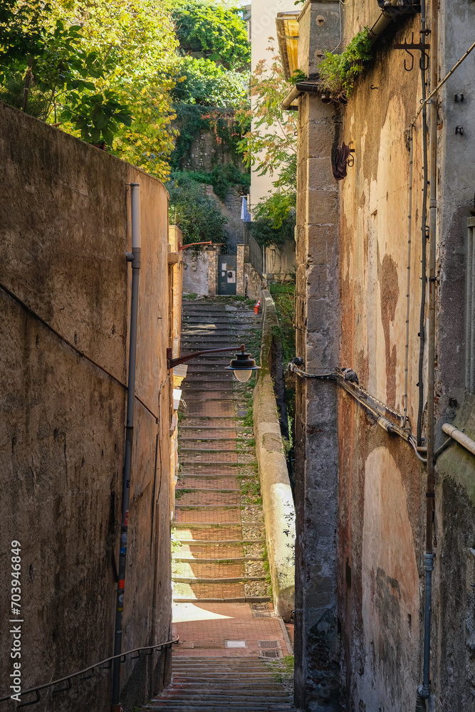 Romantic backstreet, side street or alley in historic old town of Genoa ...