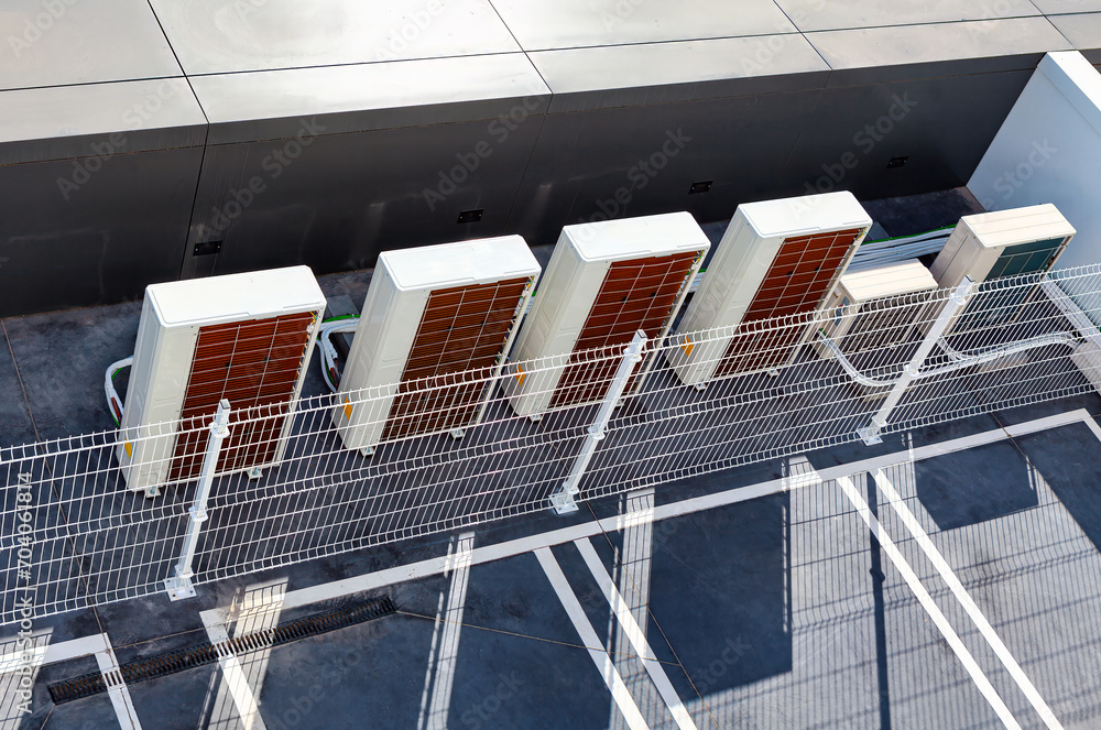 Air conditioner units on the roof of a modern office building Stock ...