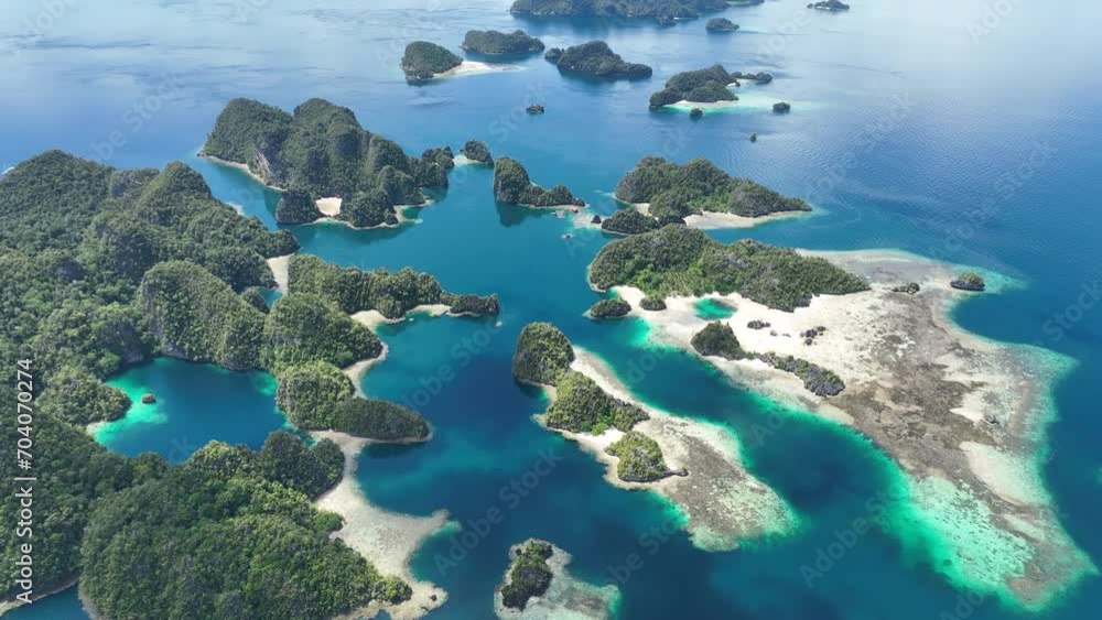 Scenic limestone islands, fringed by coral reefs, rise from the amazing ...