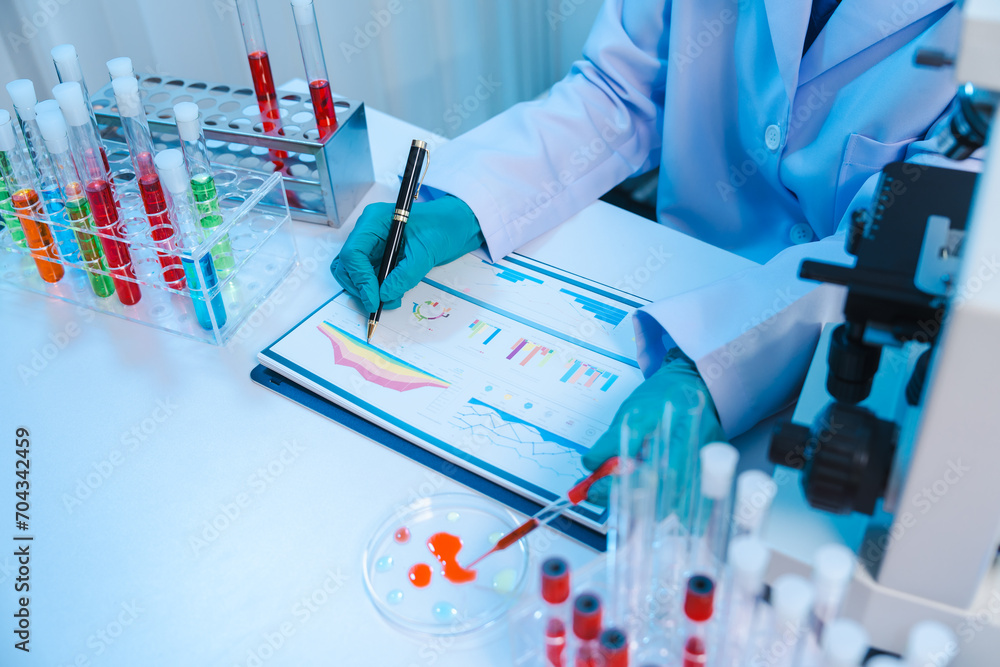 Asian people scientist in lab coat and protective gloves working with ...