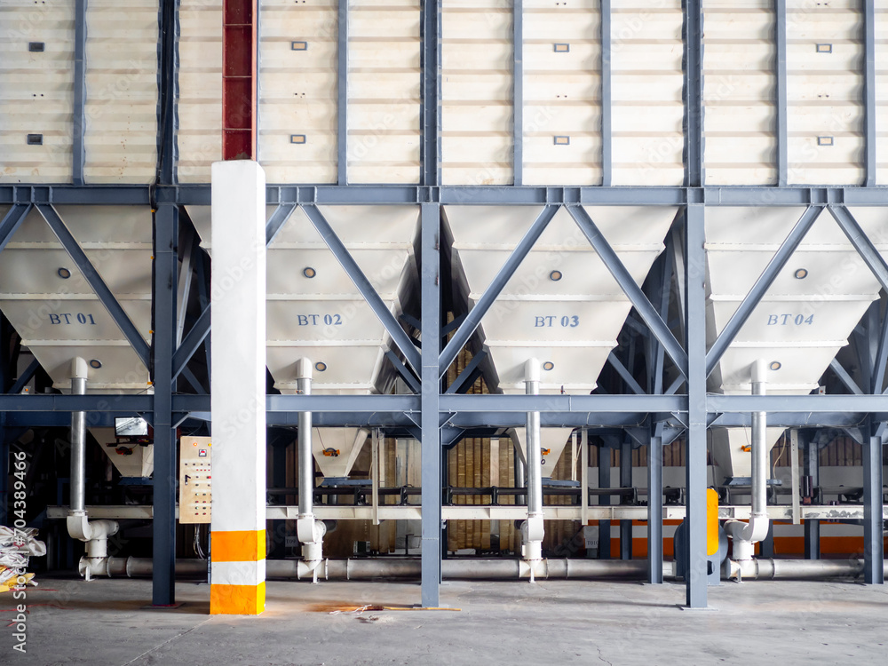Rice milling factory interior, front view of batch storage bale at rice ...