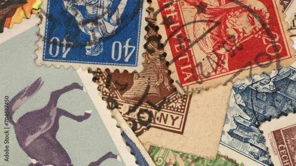 Vidéo Stock Vintage stamps collection moving on white paper background ...