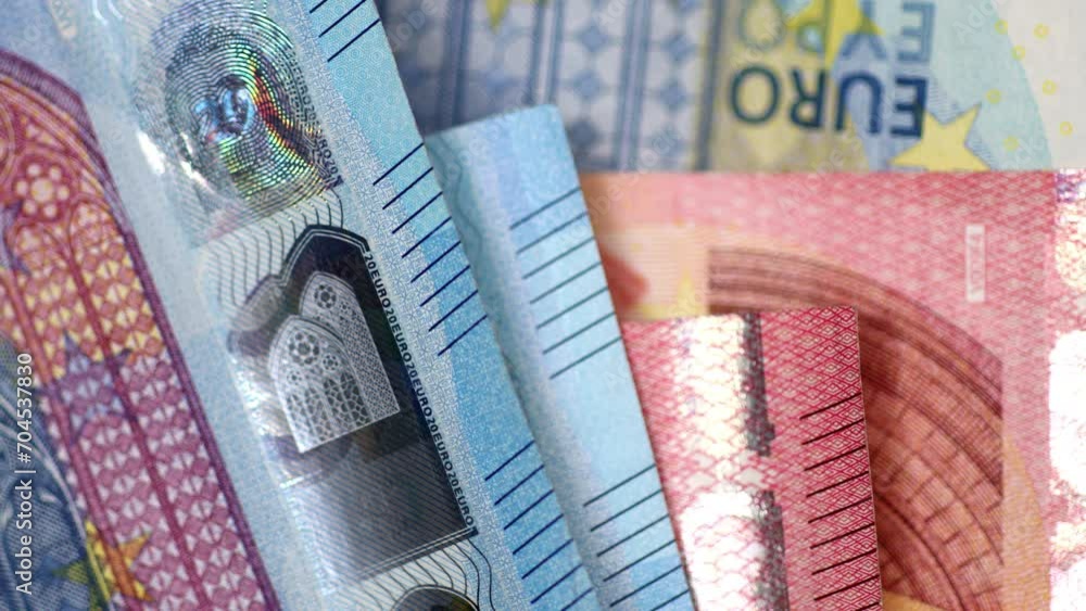 Euro banknotes moving on the blue paper background. 4K stop motion ...