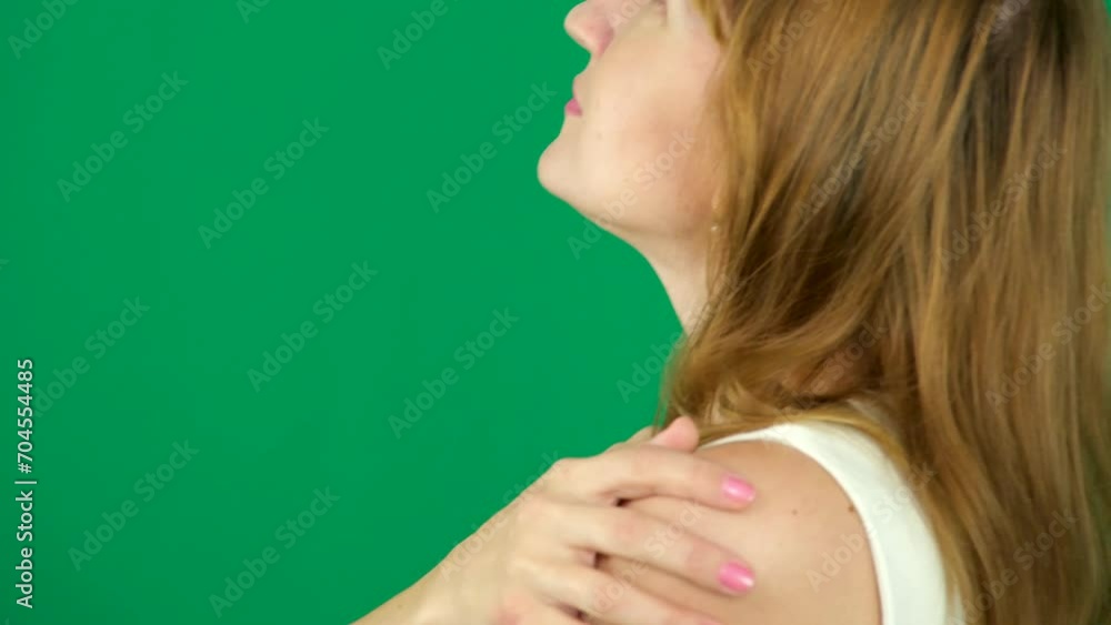 Hug yourself by the shoulders to freeze cold. woman in white dress with ...