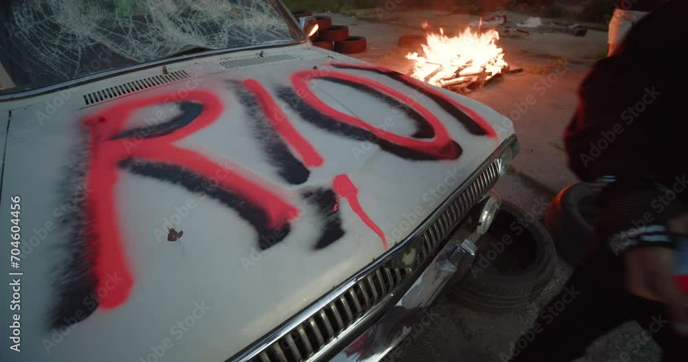 Vidéo Stock Riot Fire. Protest. Vandalism Punk protester girl uses a ...
