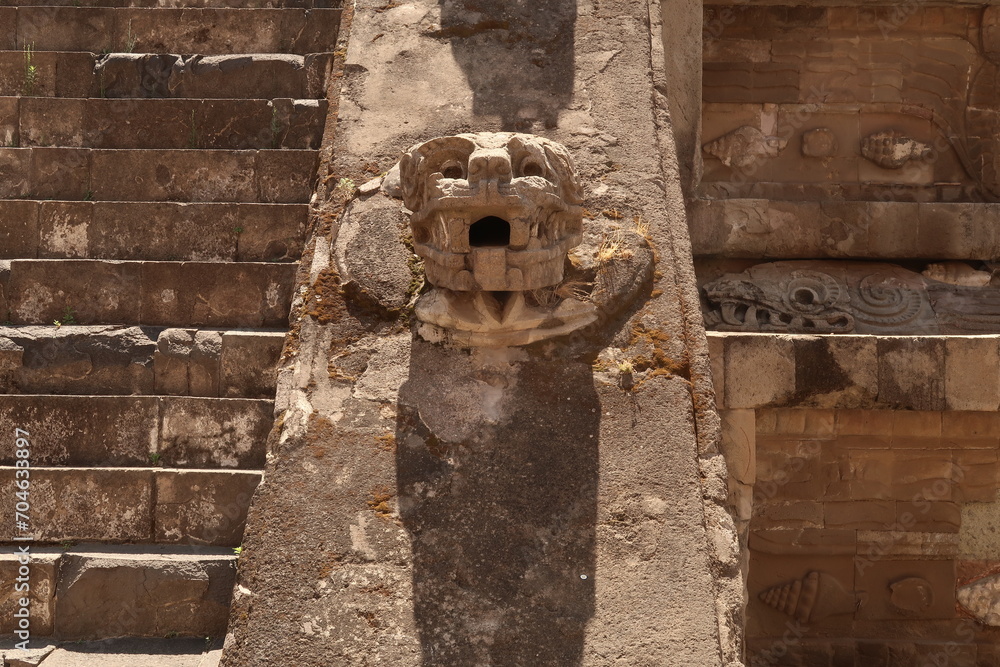 Closer look on one of the snake heads attached next to the stairs of ...