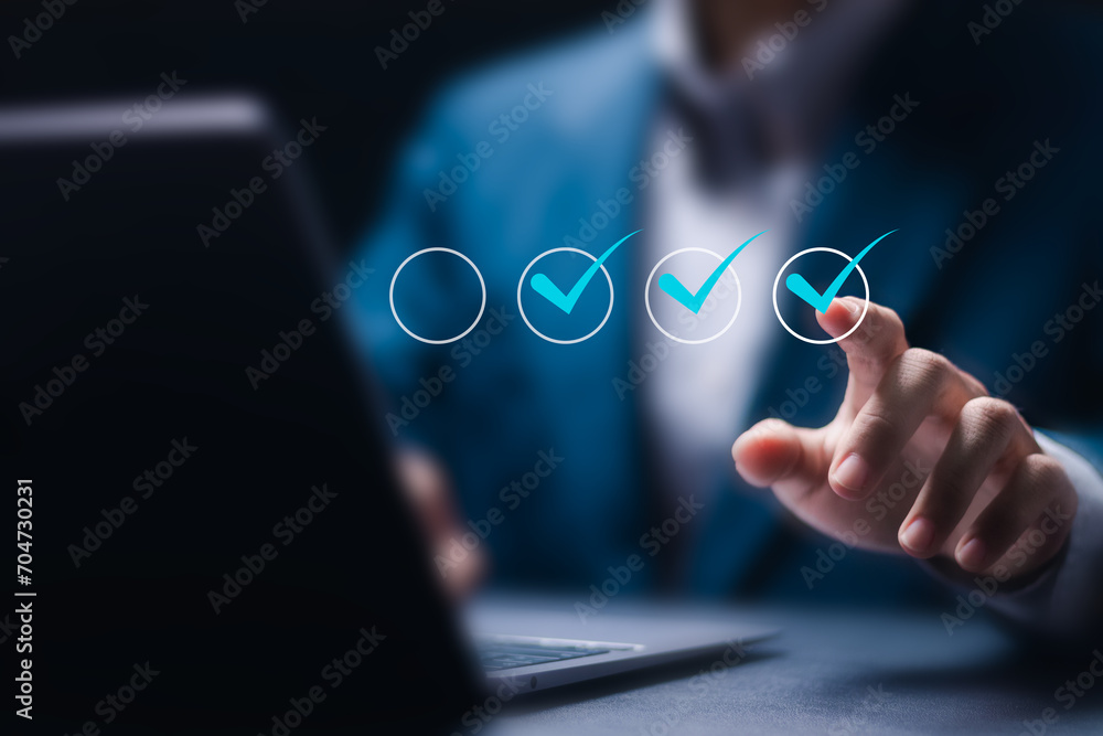 Businessman tick virtual checklist and takes online assessment survey ...