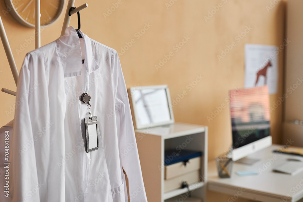 Lab coat hanging on clothes rack in veterinary clinic Stock Photo ...