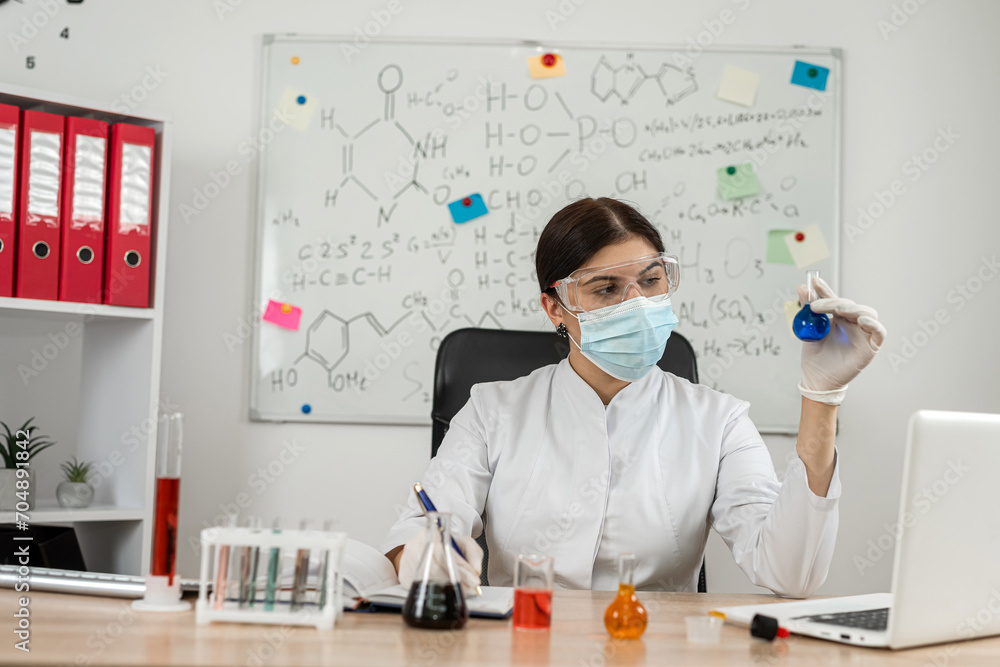 Caucasian lab worker doing test or research in clinical laboratory with ...