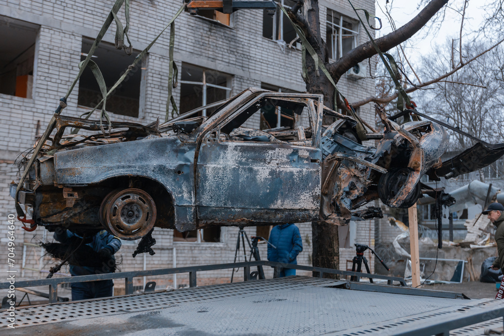 Loading the car onto a tow truck. Shahed blew up houses. A bombed ...