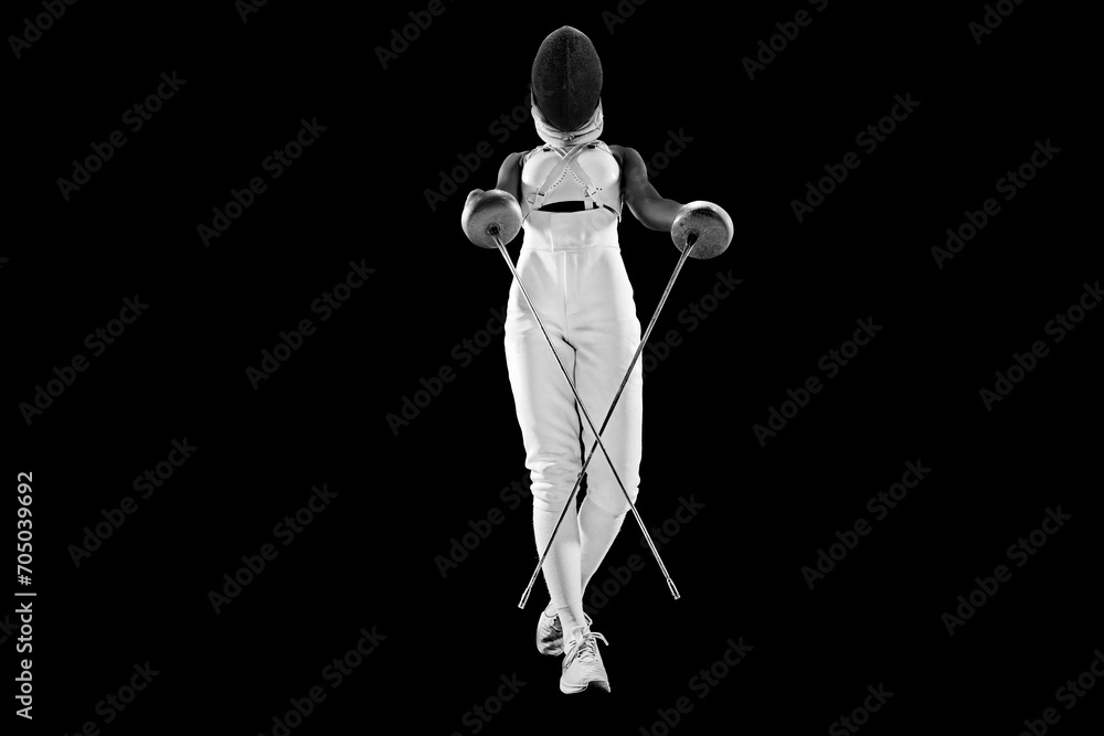 Fierce female fencer, gracefully wielding swords in dynamic pose ...