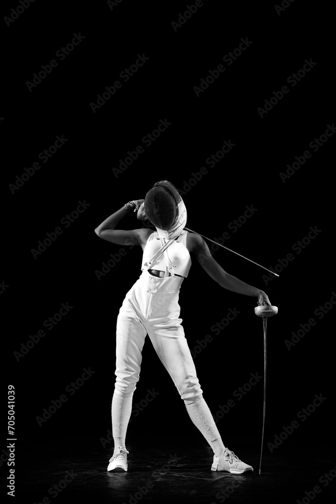 Fencing maestro, gracefully posing with fencing foil, radiating ...