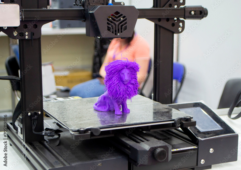 Model of toy lion printed on 3D printer from melted plastic purple ...