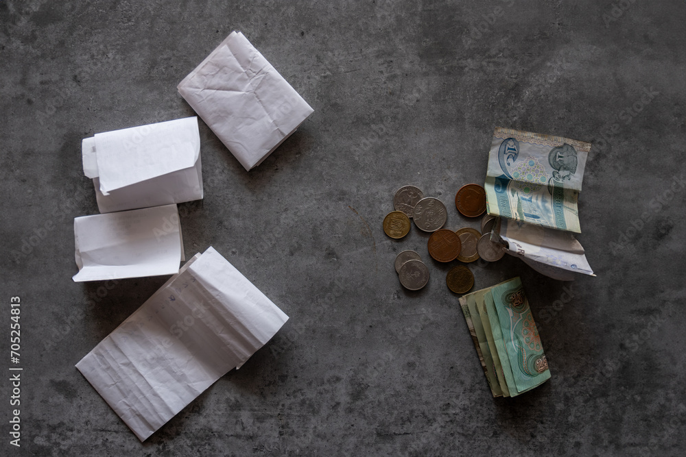 bills and cash on each side represents the cash flow on grey background ...