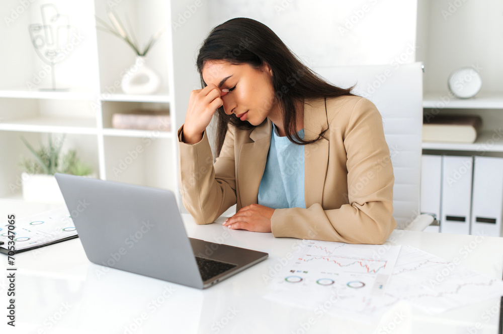 Upset frustrated overworked arabian or indian business woman, company ...