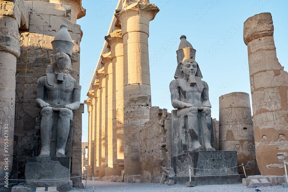 Seated statue of Ramesses II by the First pylon of the Luxor Temple ...