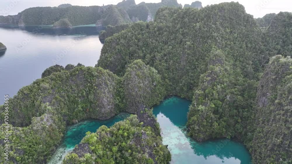 Scenic limestone islands, fringed by coral reefs, rise from the amazing ...