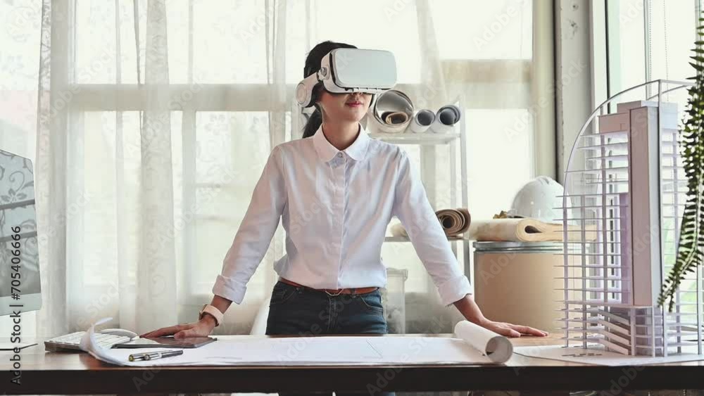 Architect young woman working with virtual reality technology modeling ...