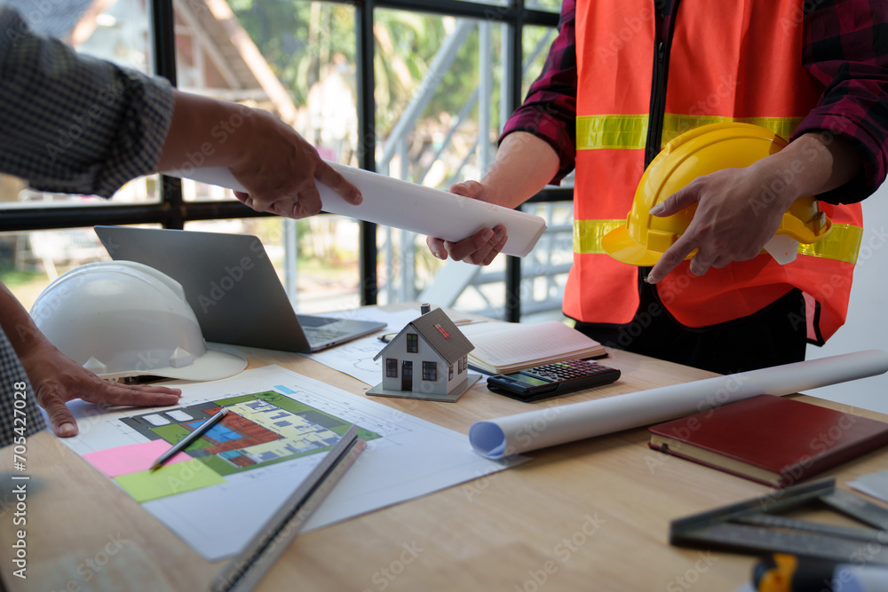 Architects and engineers work together in business, submitting ...