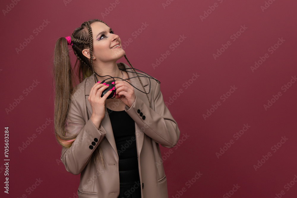 Beautiful young woman with lots of computer cables over her head ...