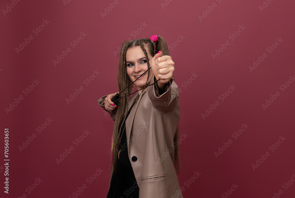 Beautiful young woman with lots of computer cables over her head ...