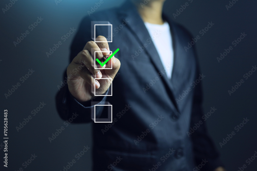 Businessman tick check mark in the box represent to check list or ...