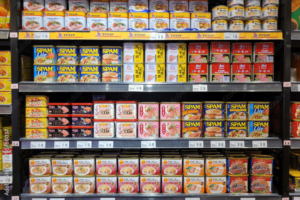 PENANG, MALAYSIA - 1 DEC 2023: Many types of canned ham are on store ...