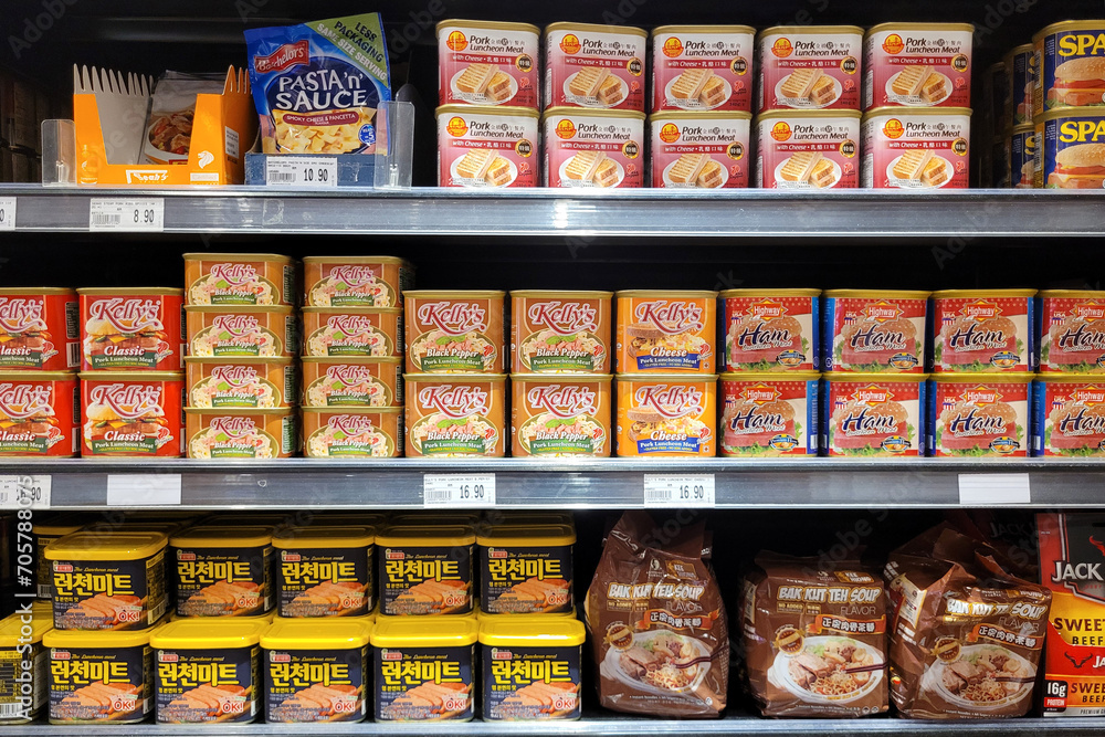 PENANG, MALAYSIA - 1 DEC 2023: Many types of canned ham are on store ...