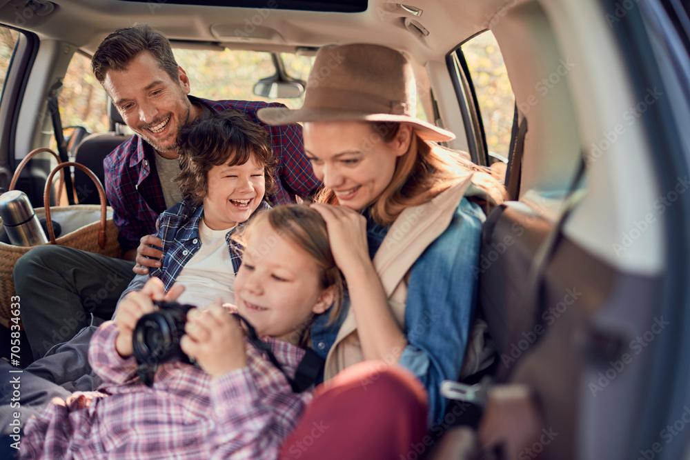 Family road trip with parents and children laughing in car Stock Photo ...