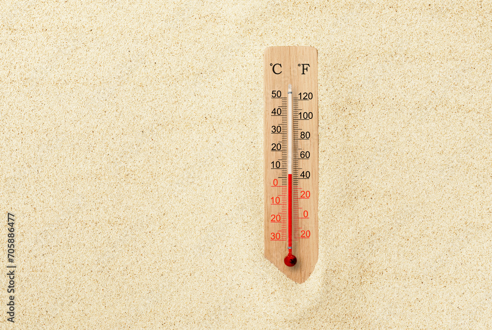 Hot summer day. Celsius and fahrenheit scale thermometer in the sand ...