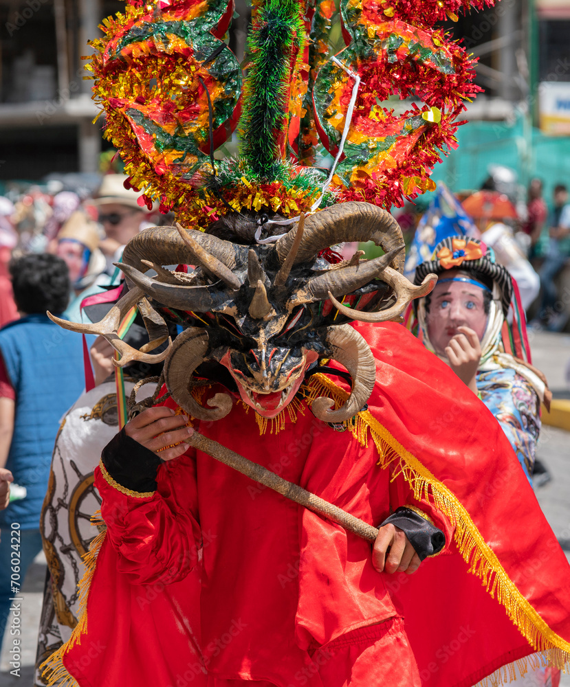 People with devil masks dancing at the Diablada Pillarena, a ...