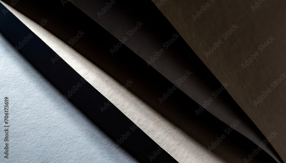 A composition of paper textures transitioning from deep black to soft ...