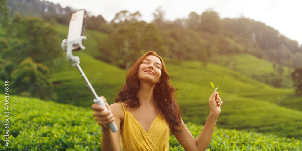 Influencer traveler woman recording video on mobile phone camera share ...