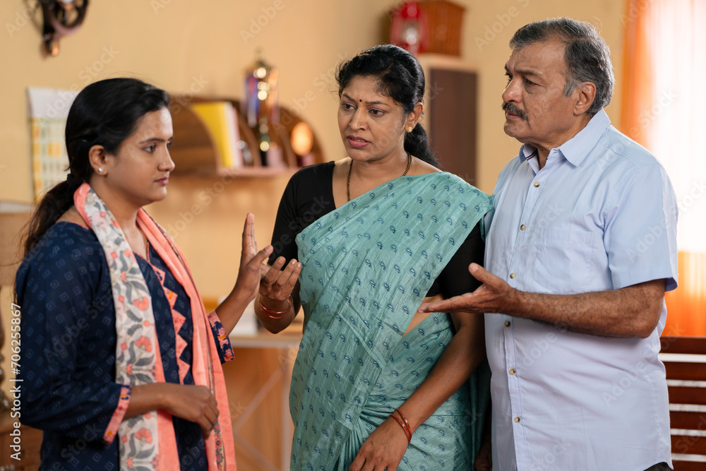 Indian teenager daughter arguing or fighting with parents at home ...