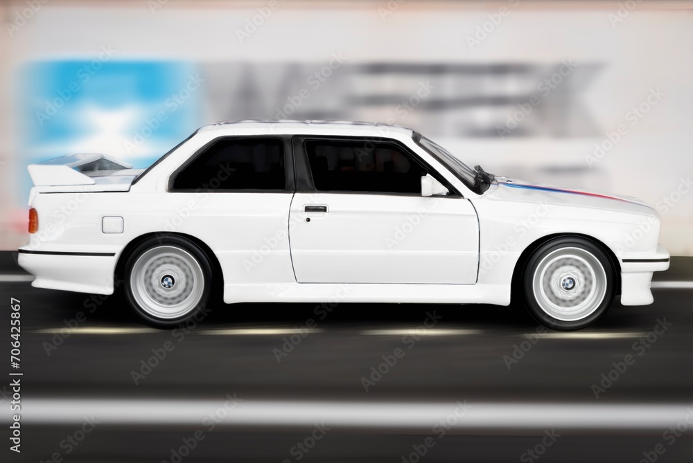 Madrid, Spain; 12-10-2023: Side view of scale model of a white Bmw M3 ...