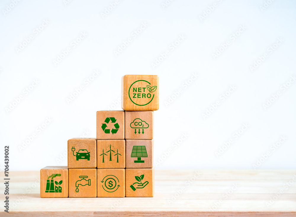 Net Zero icon and green renewable energy symbol on wooden cube block ...