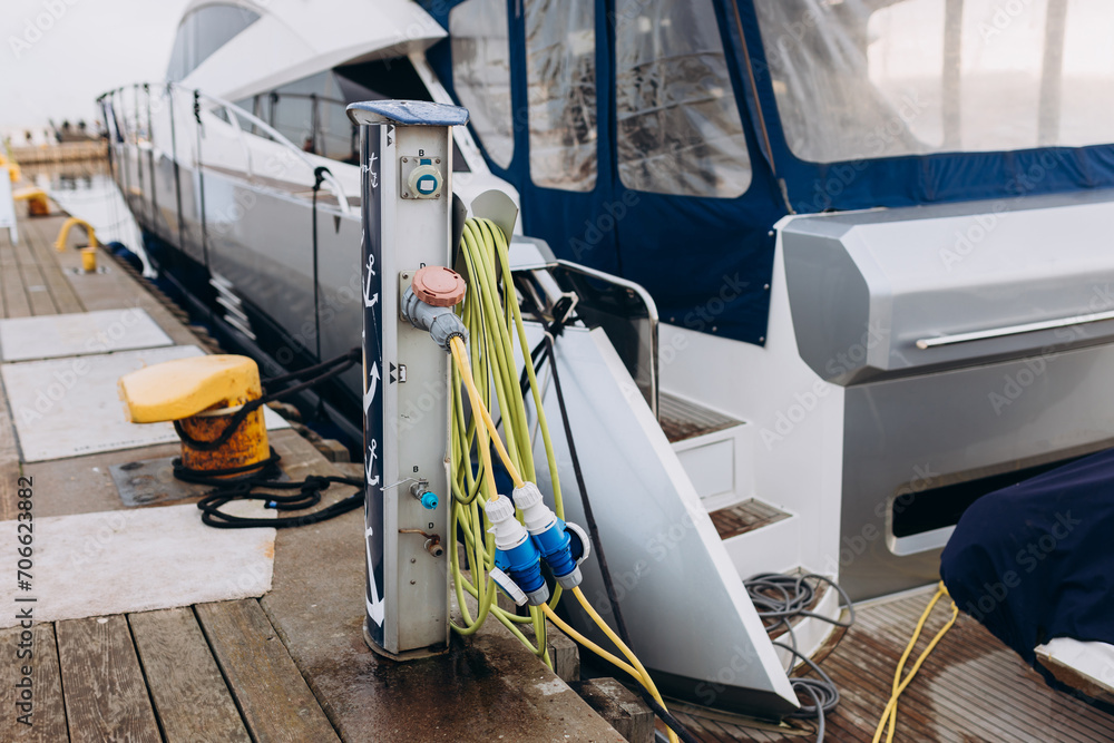 Electrical outlets to charge ships in harbor. Electrical power sockets ...