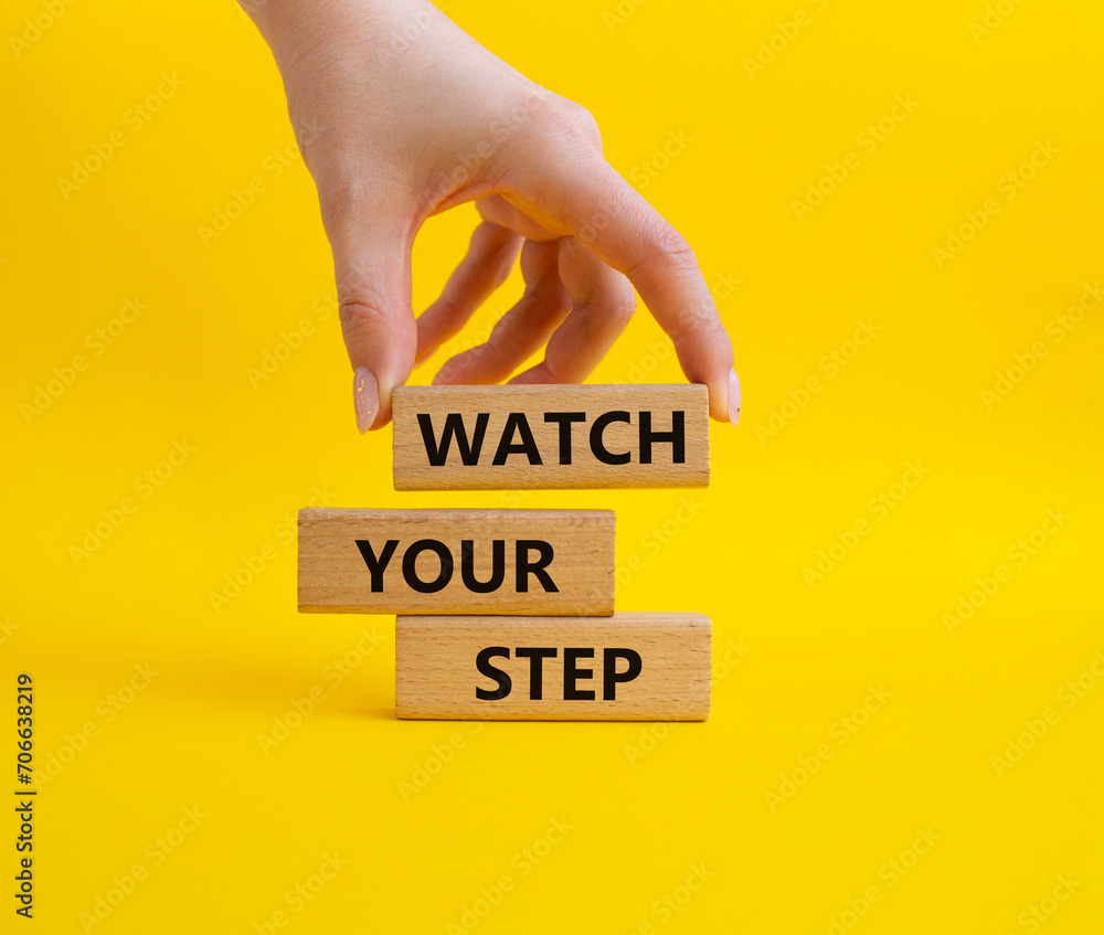 Watch your Step symbol. Concept words Watch your Step on wooden blocks ...