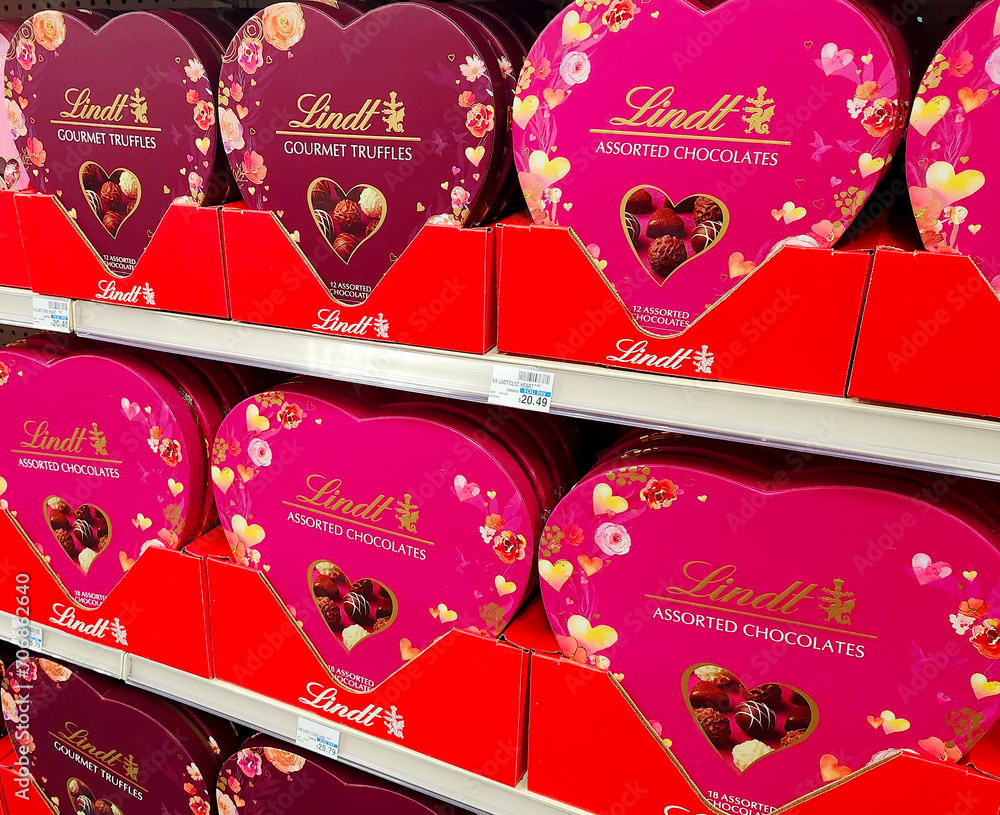 Heart shaped boxes with chocolate candies Lindt on store shelves Stock ...