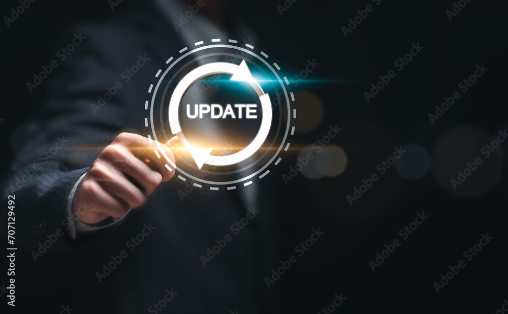 Person using magnifying glass focus to virtual update symbol for ...