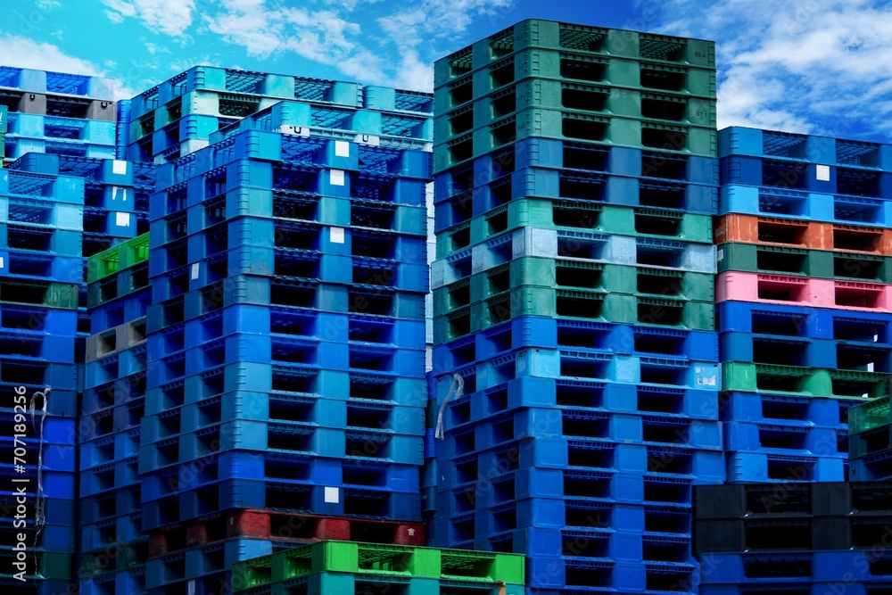 Pile of plastic shipping pallet. Industrial plastic pallet stacked at ...