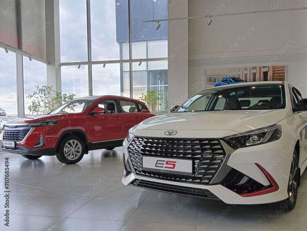 Chinese sedan Kaiyi E5 in white from Chery Automobile and crossover Beijing X5 BAIK X5 in red ...
