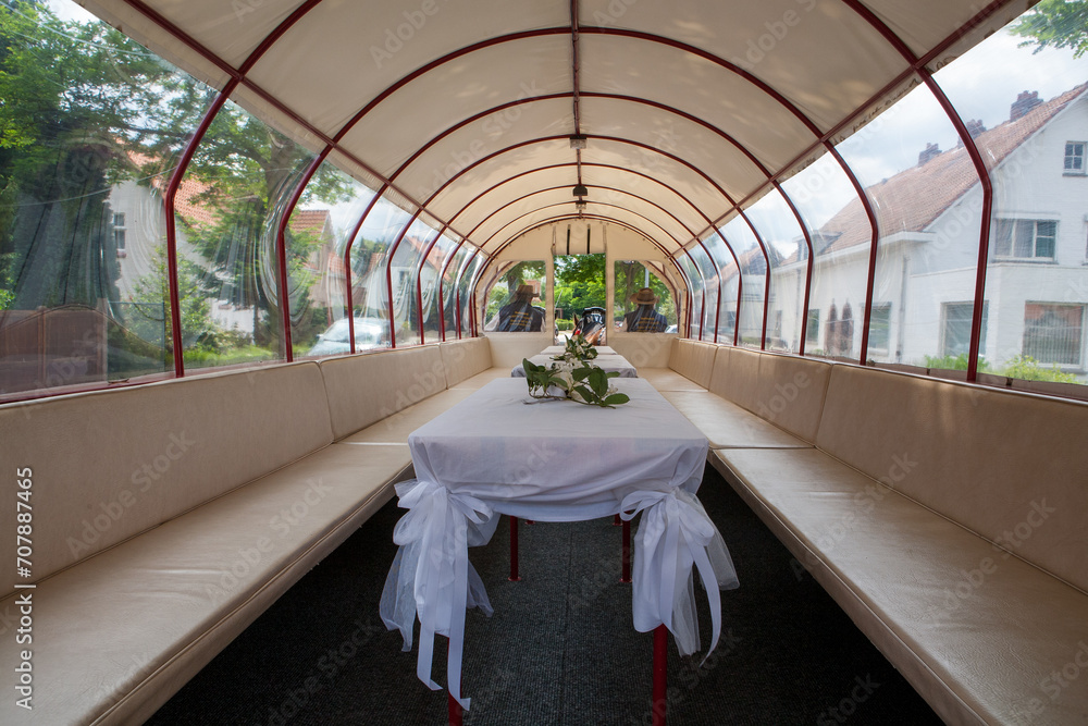 This photograph captures the refined interior of a dining car, possibly ...