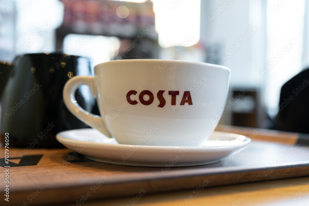 Mug with hot drink and logo sign of Costa Coffee, British coffeehouse ...