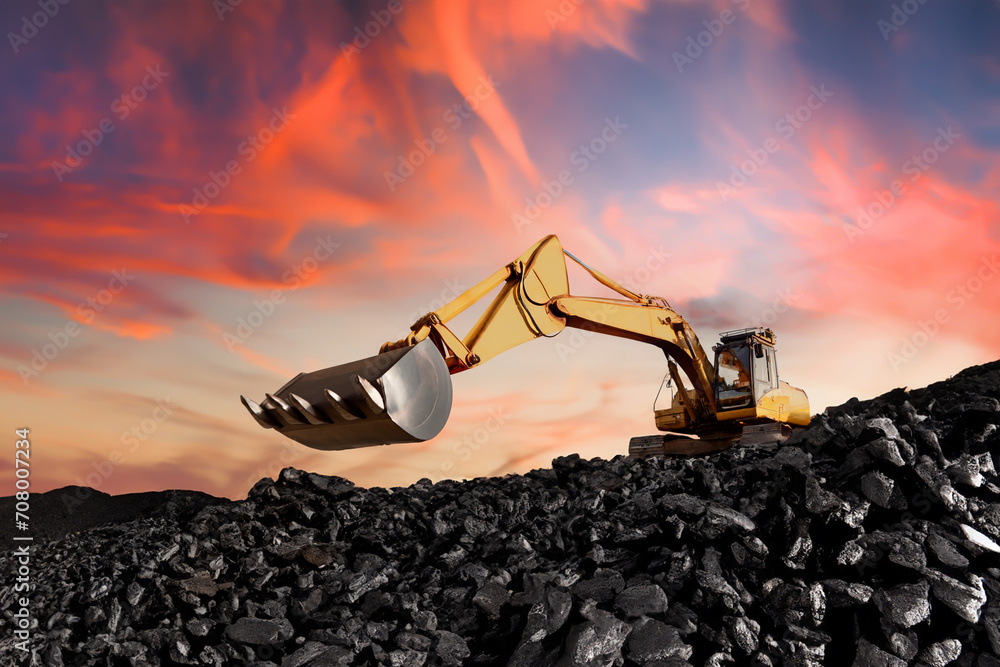 Excavator on earthworks at construction site on sunset background ...