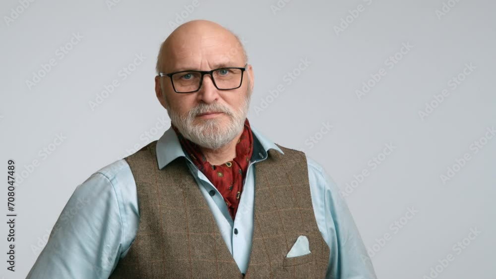 Distinguished man in his 50s with a serious gaze into the camera ...