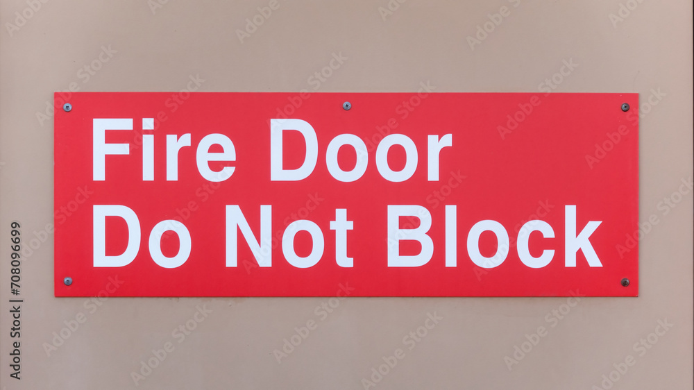 Fire door signage on fire safety exit door Stock Photo | Adobe Stock