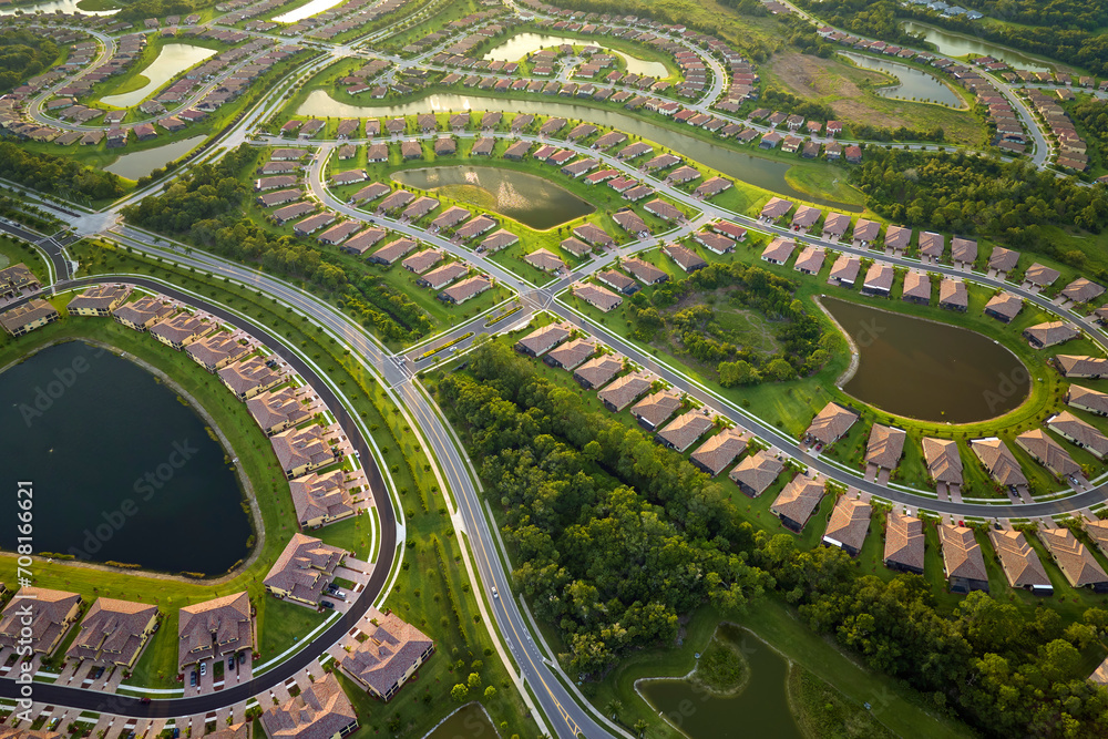 View from above of densely built residential houses near retention ...